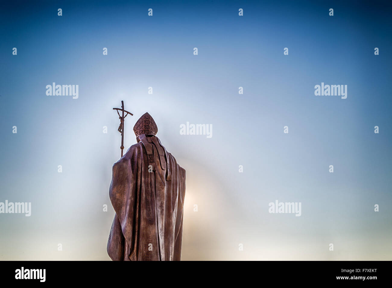 bronze statue of Holy Pope with Crucifix seen from the back Stock Photo ...