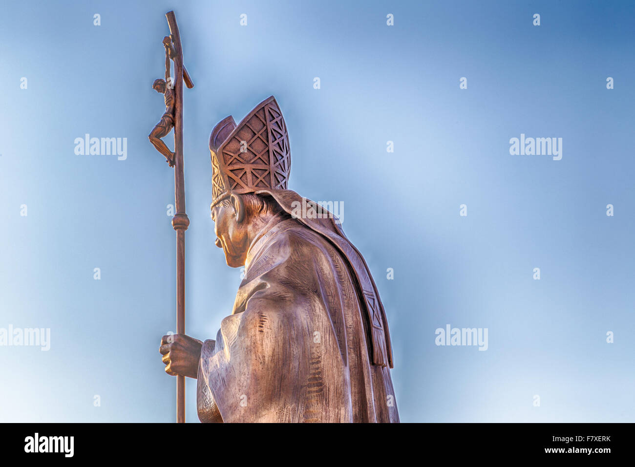 bronze statue of Holy Pope with Crucifix seen from the back Stock Photo ...
