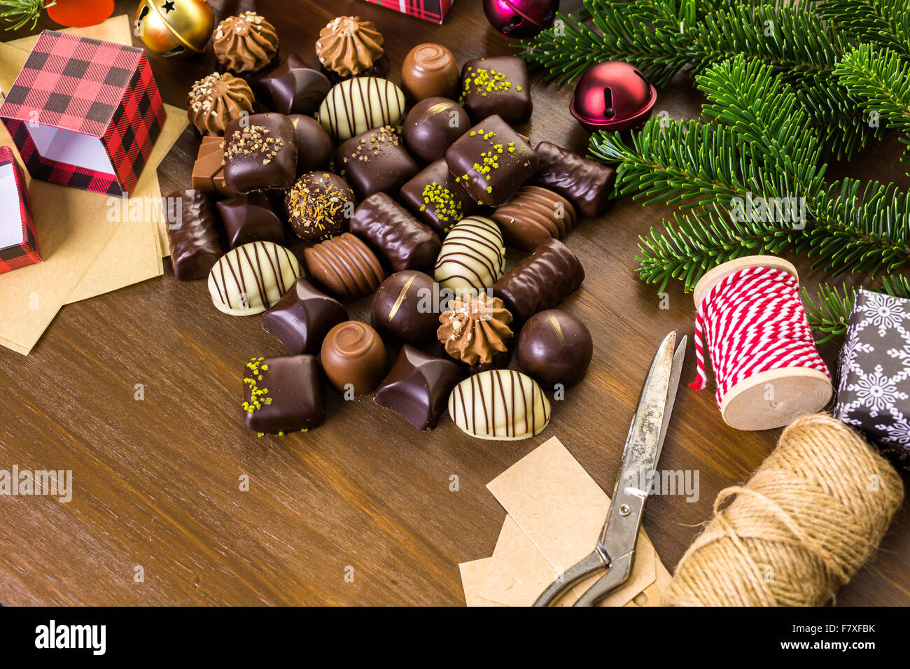 Wrapping assorted chocolates in small boxes for Christmas presents ...