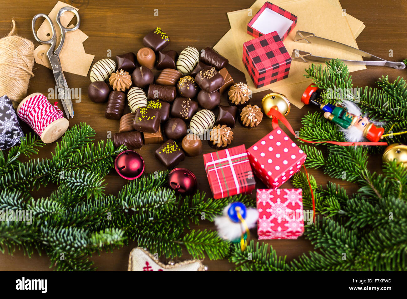 Wrapping assorted chocolates in small boxes for Christmas presents ...