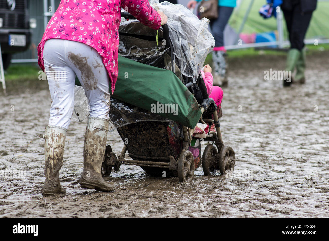 Muddy time at music festival in Guildford Stock Photo - Alamy