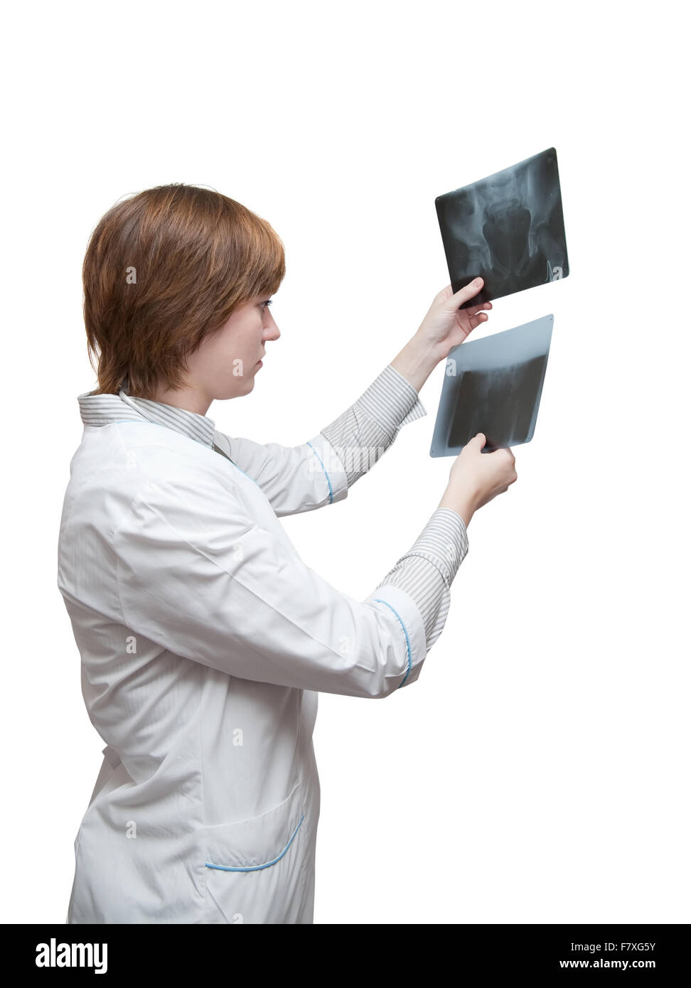 Woman doctor looking at x-ray, isolated over white Stock Photo - Alamy