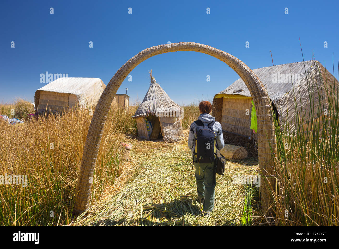 Tourist roaming in a village of the Uros Islands, entirely made of ...