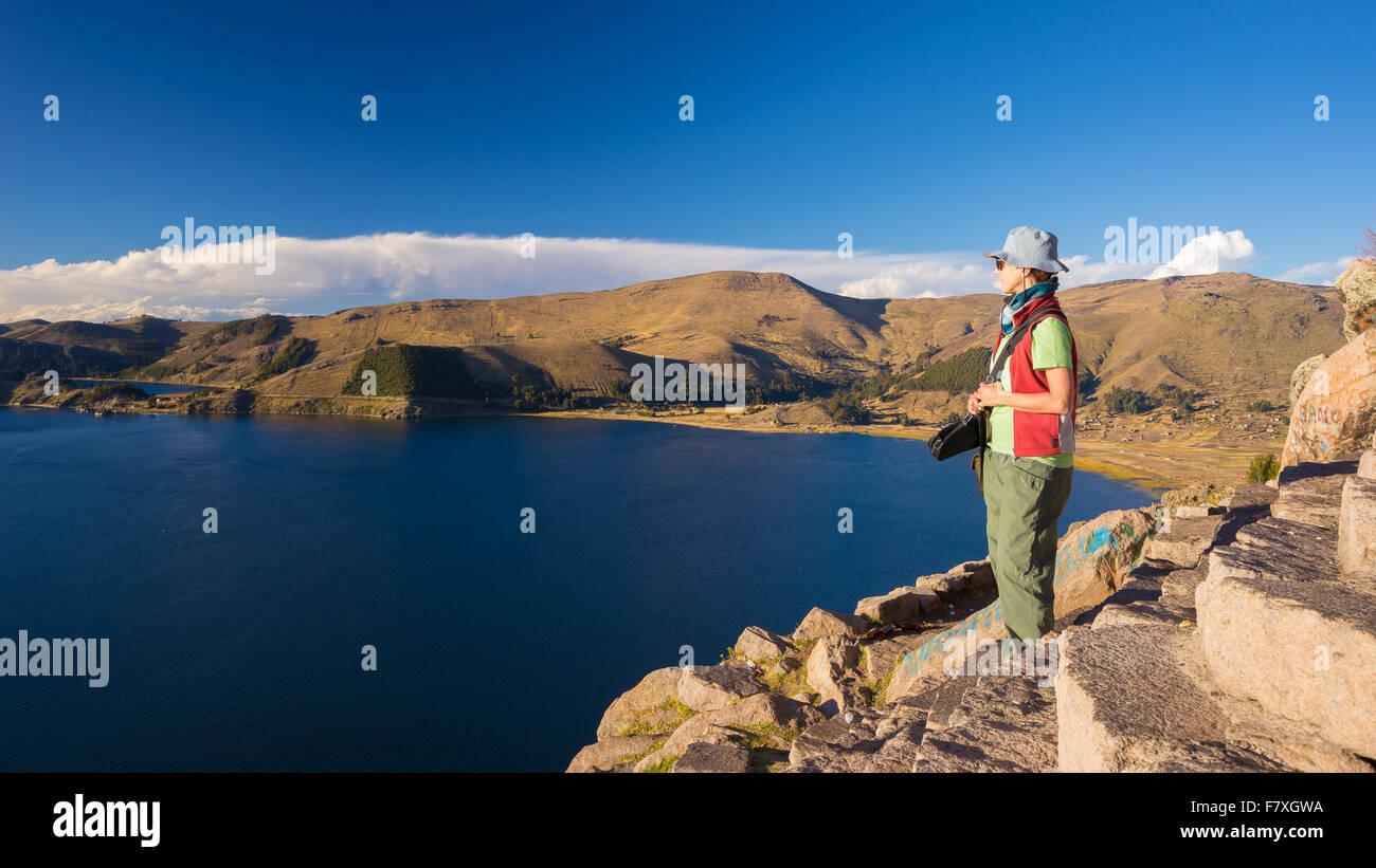 Female tourist looking up sky hi-res stock photography and images - Alamy