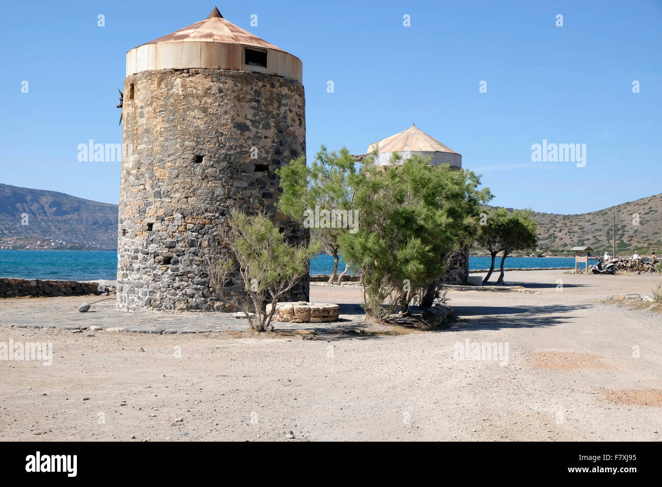 Ruined windmills at the entrance to the Peninsula of Spinalonga ...