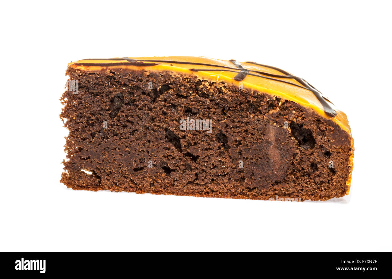 Piece of chocolate cake with icing on white isolated background Stock ...
