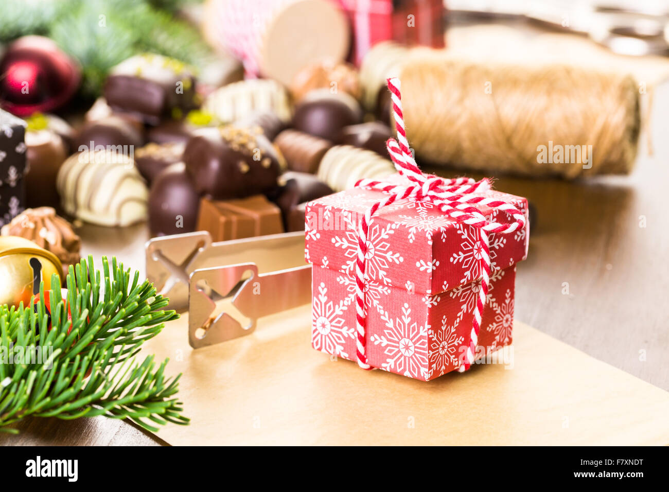 Wrapping assorted chocolates in small boxes for Christmas presents ...