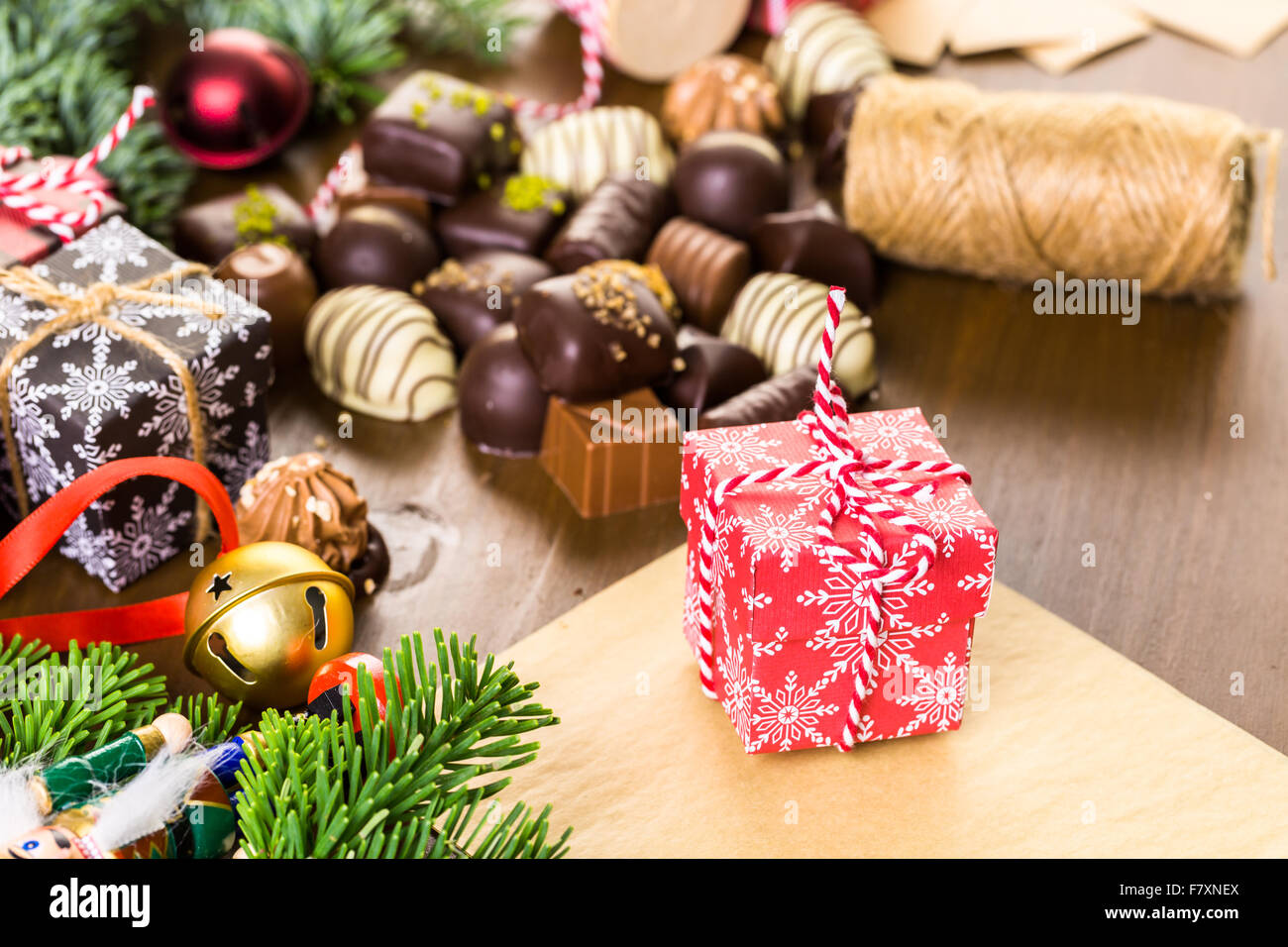 Wrapping assorted chocolates in small boxes for Christmas presents ...