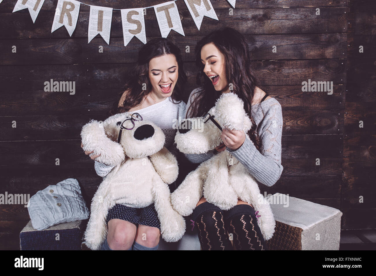 Two charming girls playing Stock Photo - Alamy