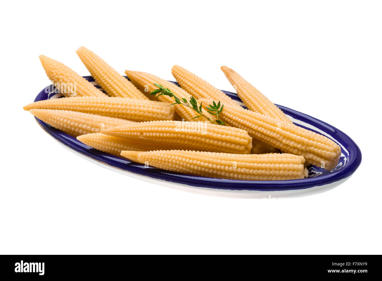 Baby corn with thyme Stock Photo - Alamy