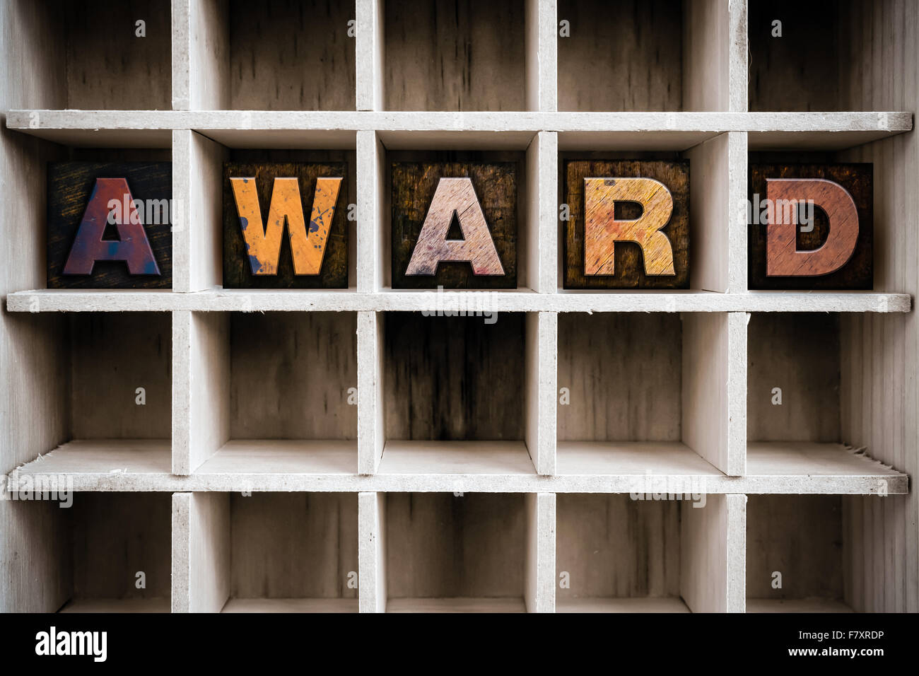 The word "AWARD" written in vintage ink stained wooden letterpress type ...