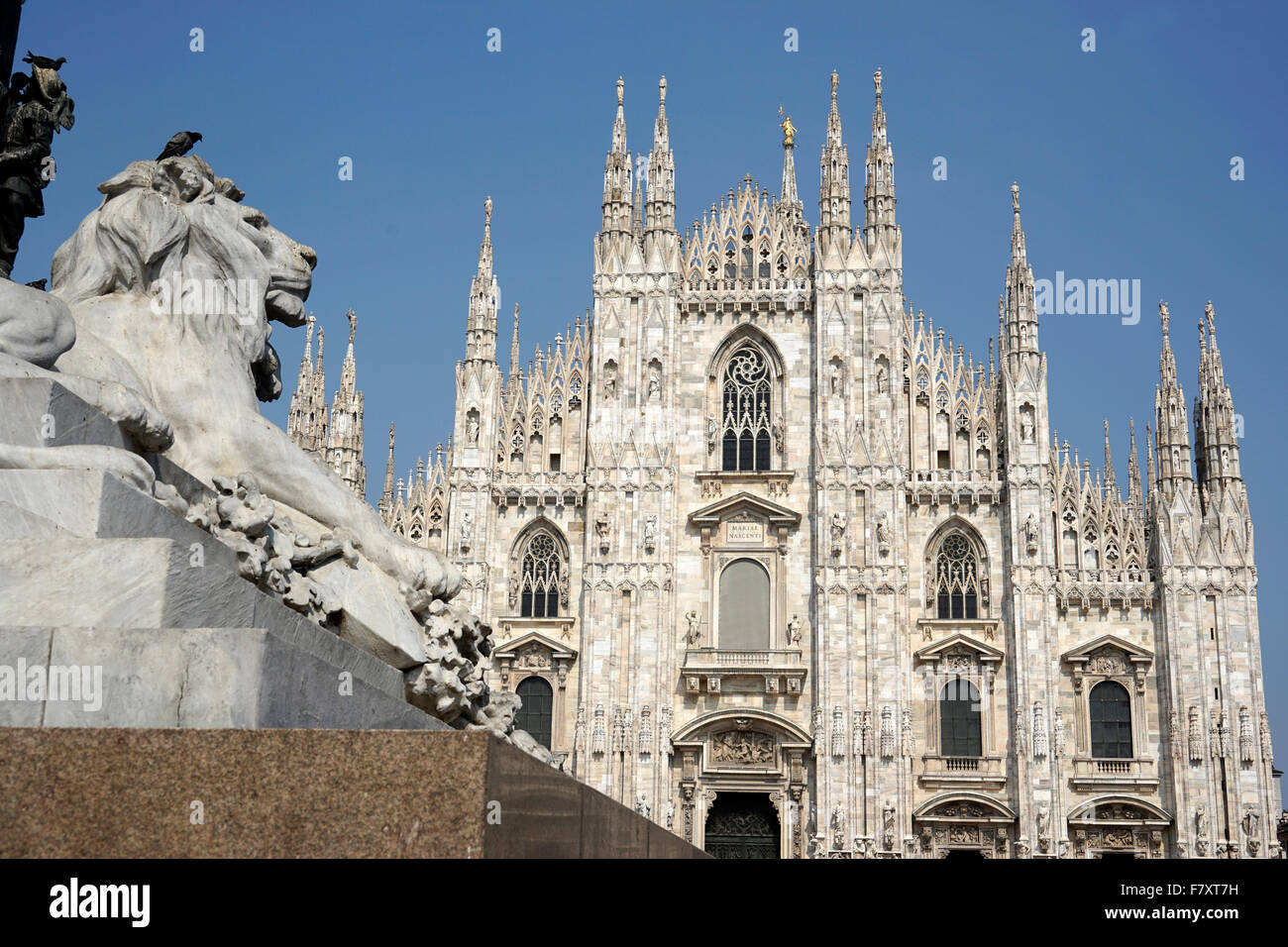 Lion sculpture on the base of Monument of Victor Emmanuel II with Duomo ...