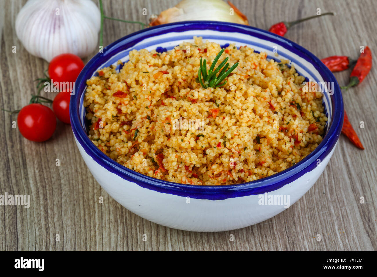 Arabic traditional cuisine - Couscous with tomato and green onion Stock ...