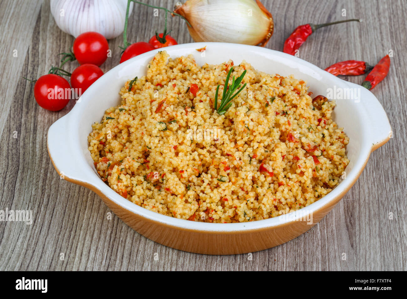 Arabic traditional cuisine - Couscous with tomato and green onion Stock ...