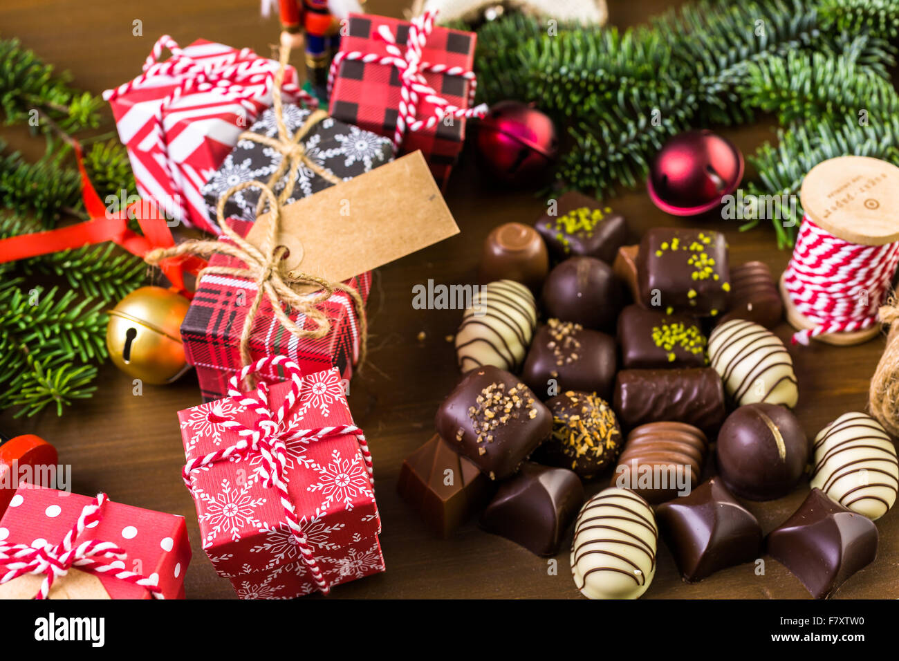 Wrapping assorted chocolates in small boxes for Christmas presents ...