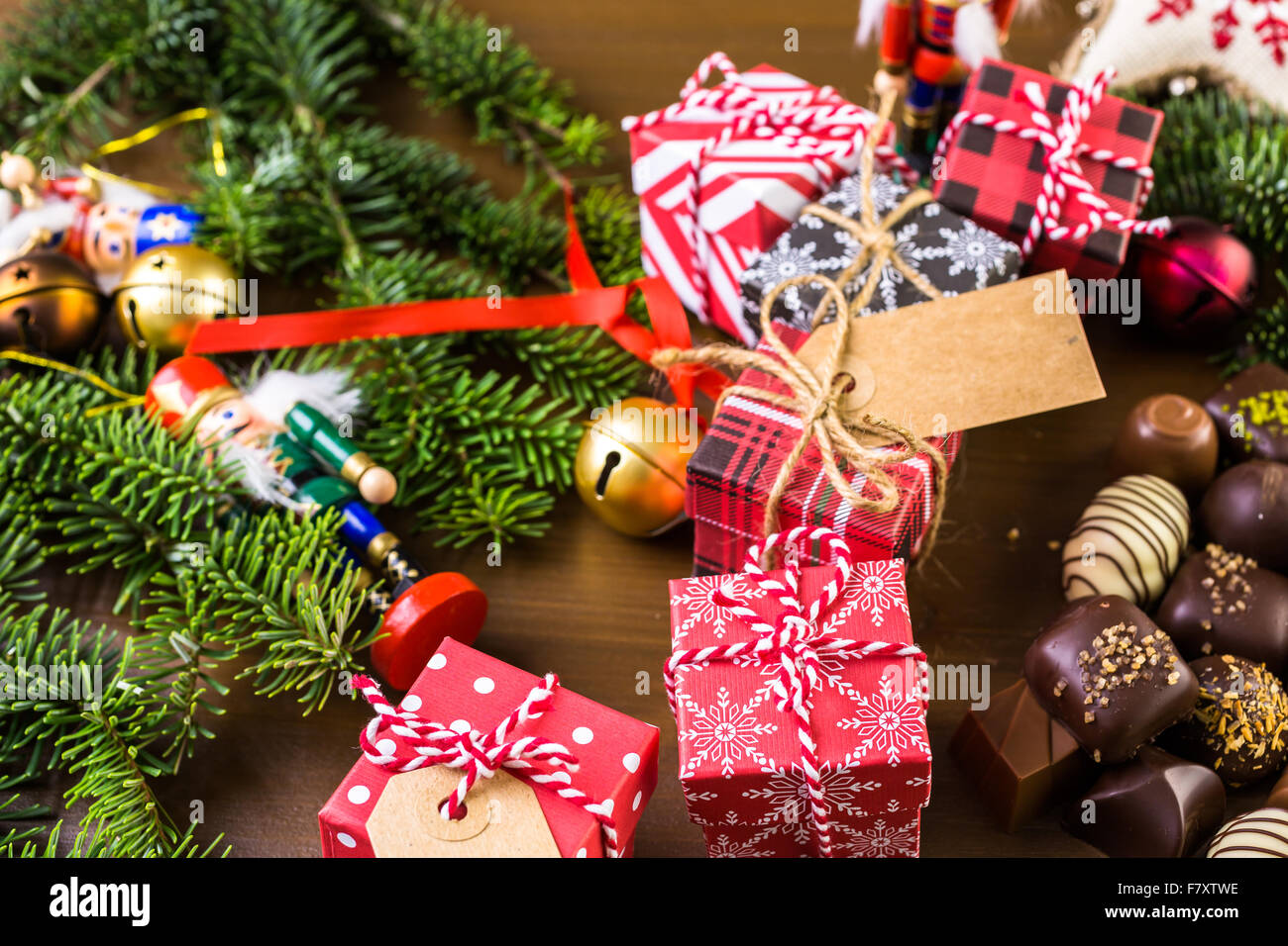 Wrapping assorted chocolates in small boxes for Christmas presents ...