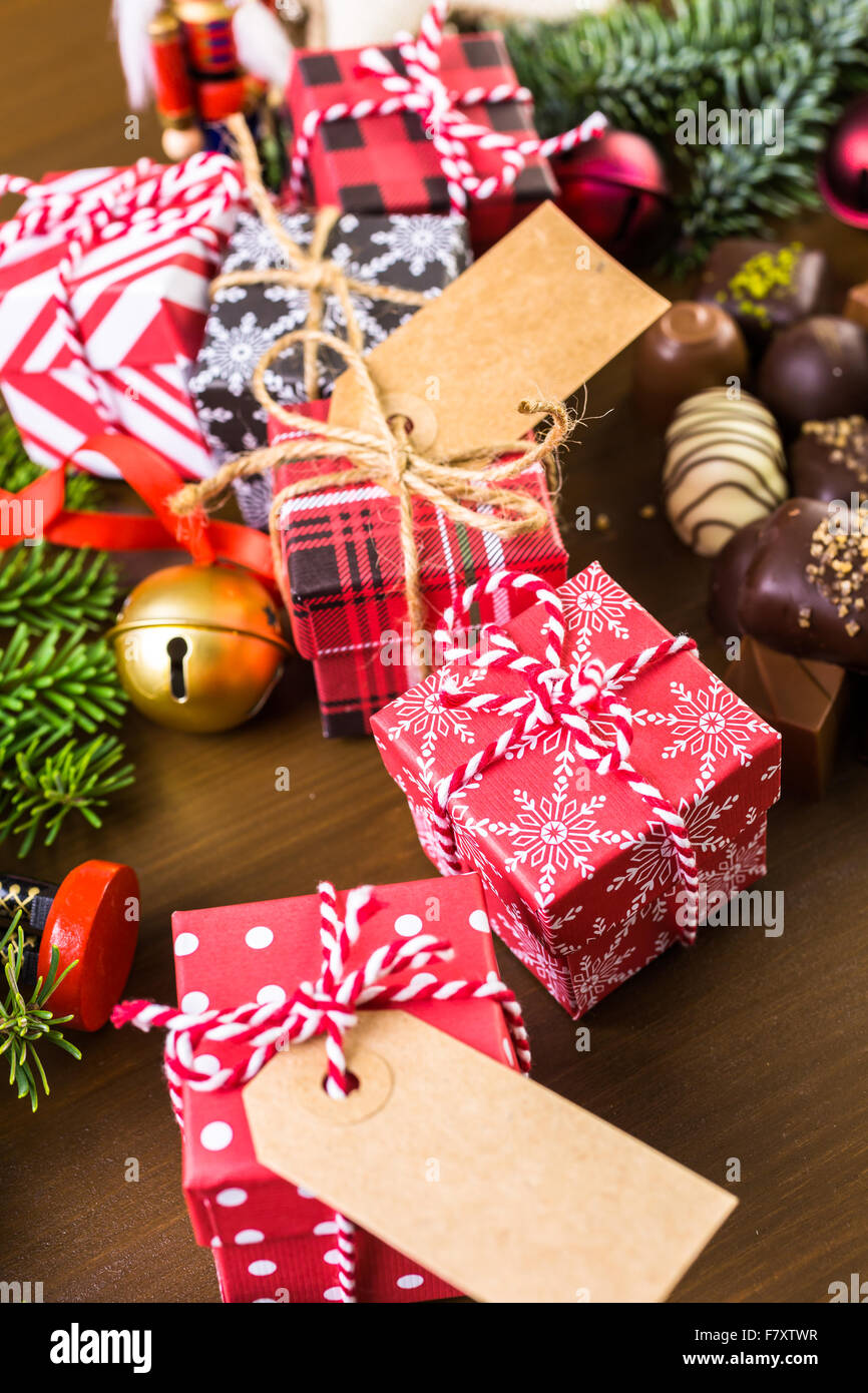 Wrapping assorted chocolates in small boxes for Christmas presents ...