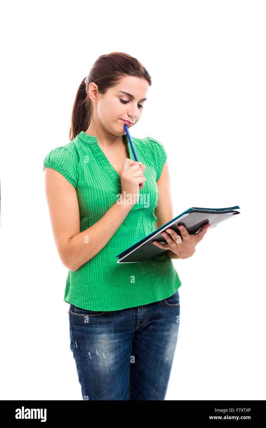 Beautiful female student thinking, isolated over a white background ...