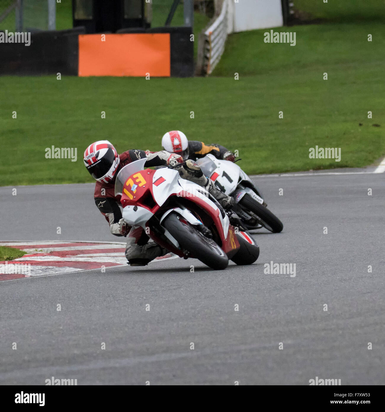 Two motorcycles round Clearwater Bend at Brands Hatch on a track day ...