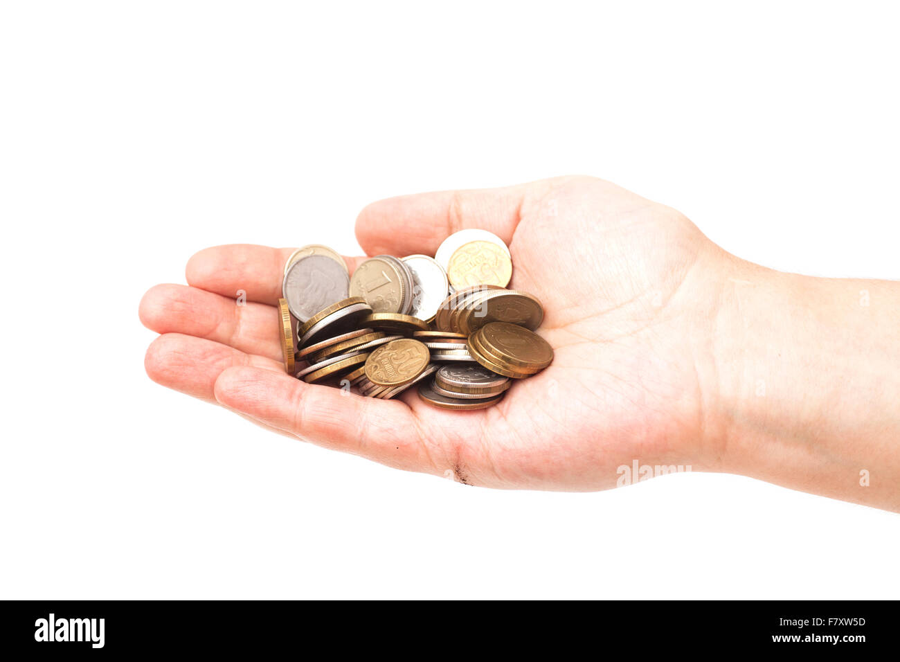 Handful of coins in palm hand isolated on white Stock Photo - Alamy