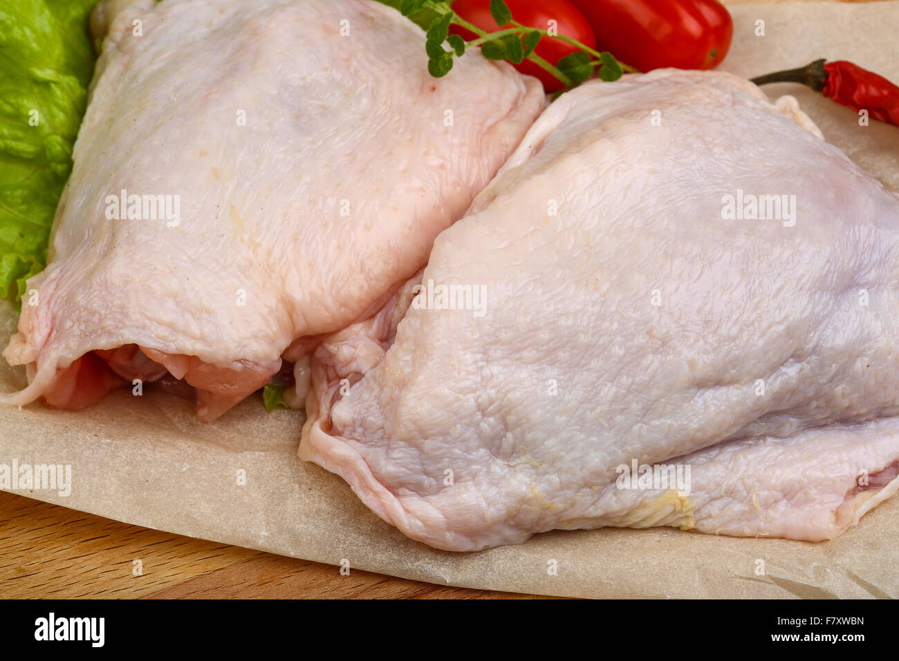 Raw chicken legs meat with herbs and spices ready for cooking Stock ...