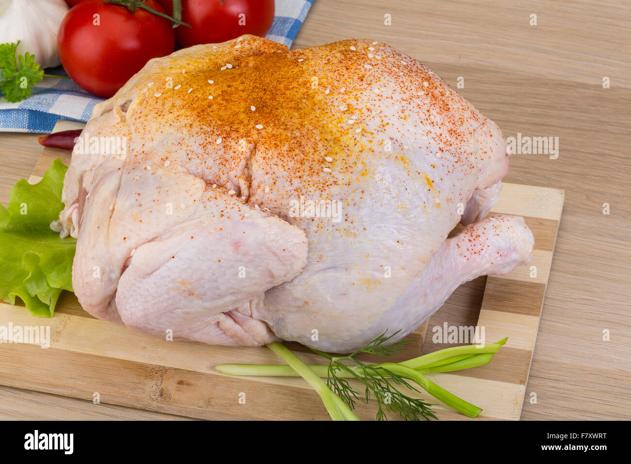 Raw chicken with herbs and spices ready for cooking Stock Photo - Alamy