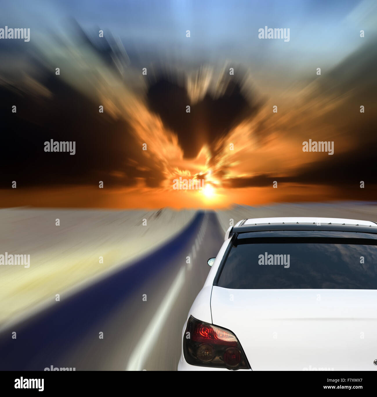 White car on desert road under sunset sky Stock Photo - Alamy