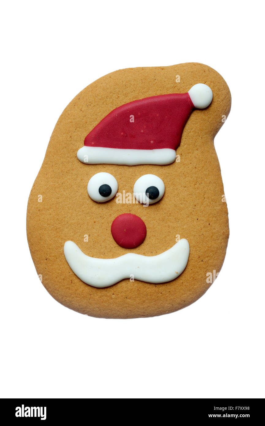 festive design christmas iced gingerbread biscuit cut out on white ...