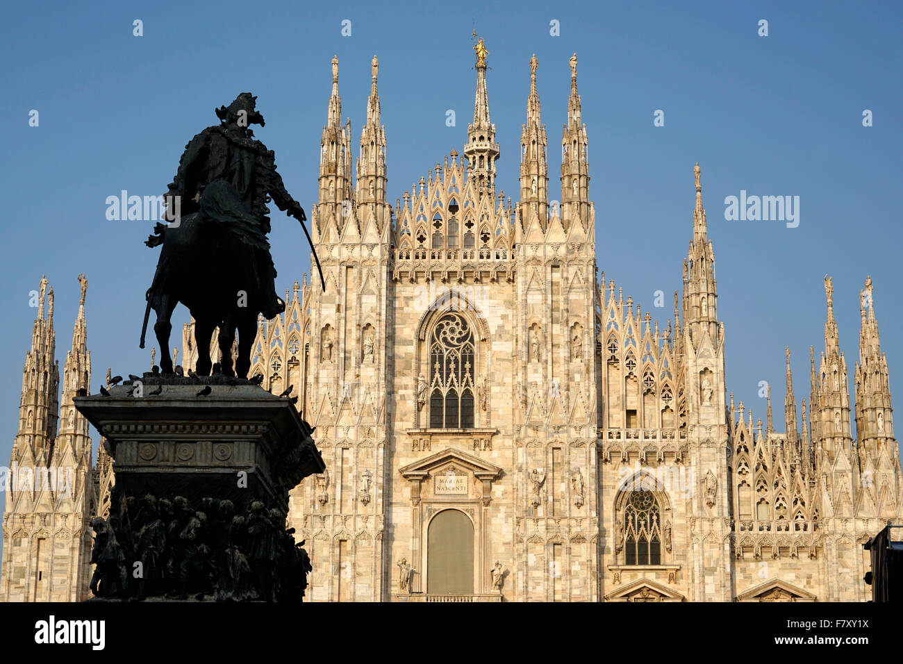 Milan Cathedral aka Duomo with the silhouette of equestrian statue of ...