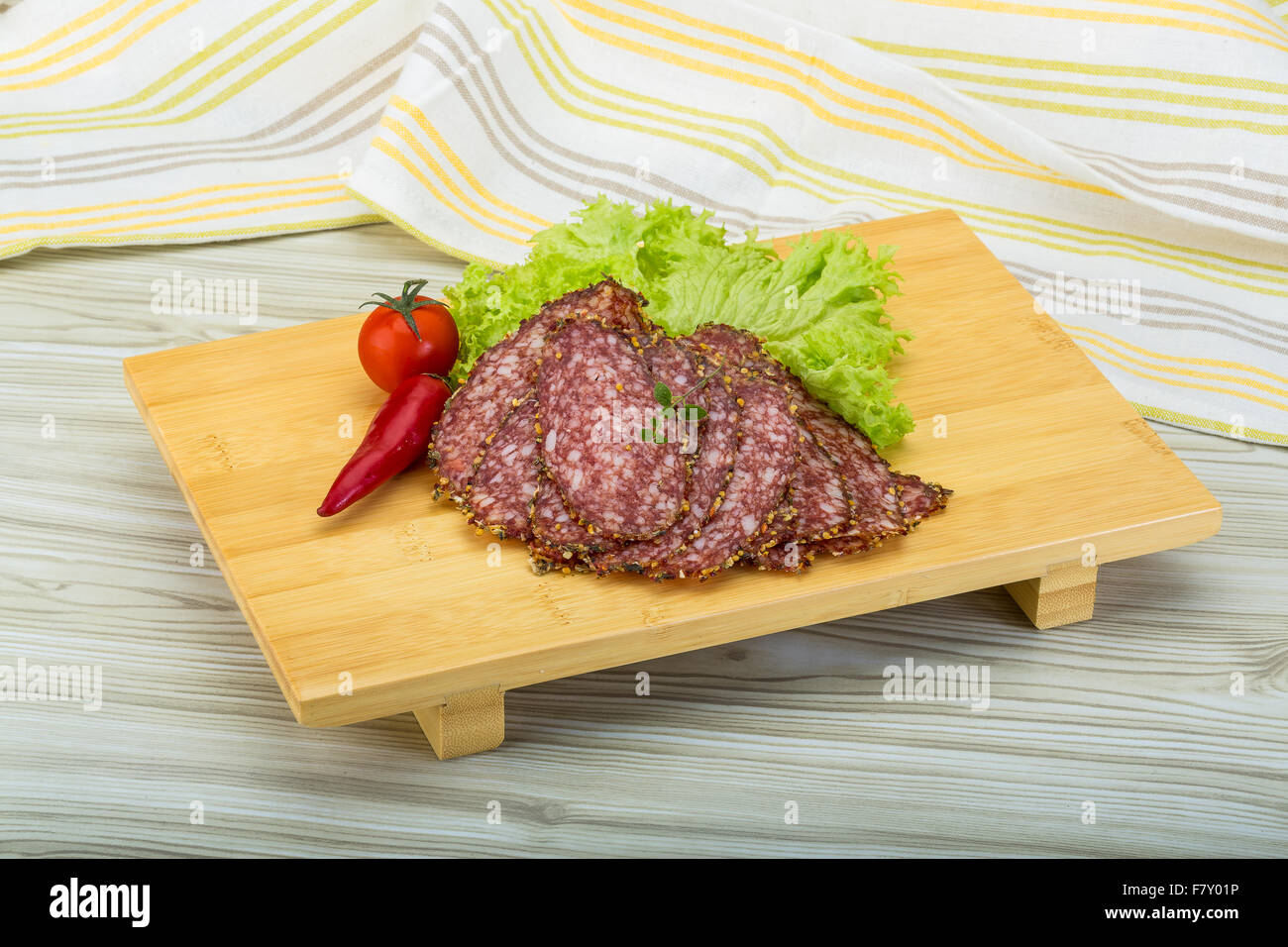 Sliced salami - with herbs and spices Stock Photo - Alamy
