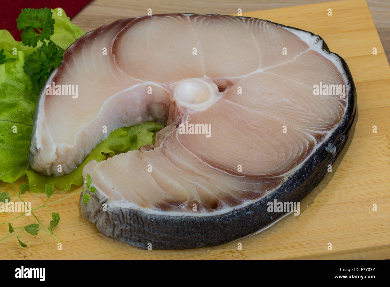 Raw blue shark steak with salad leaves and lime Stock Photo - Alamy