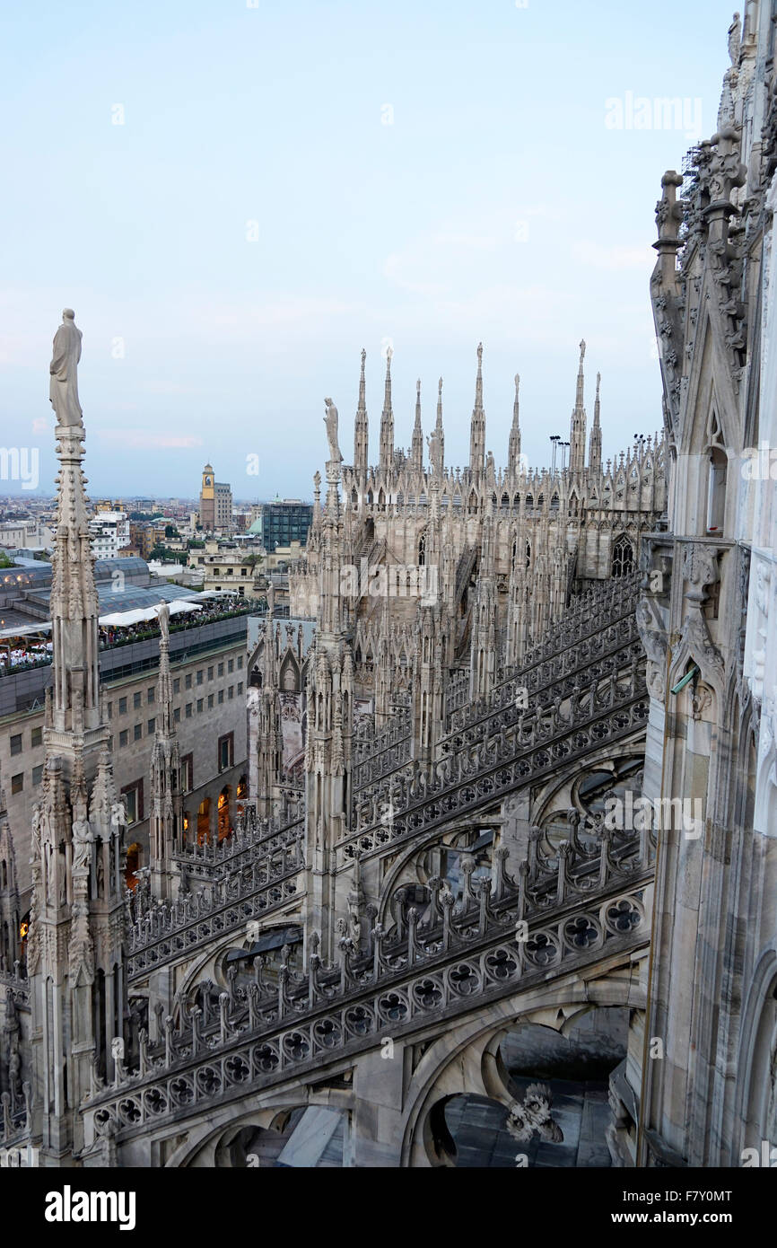 Spires on the rooftop of Milan Cathedral with the cityscape in the ...