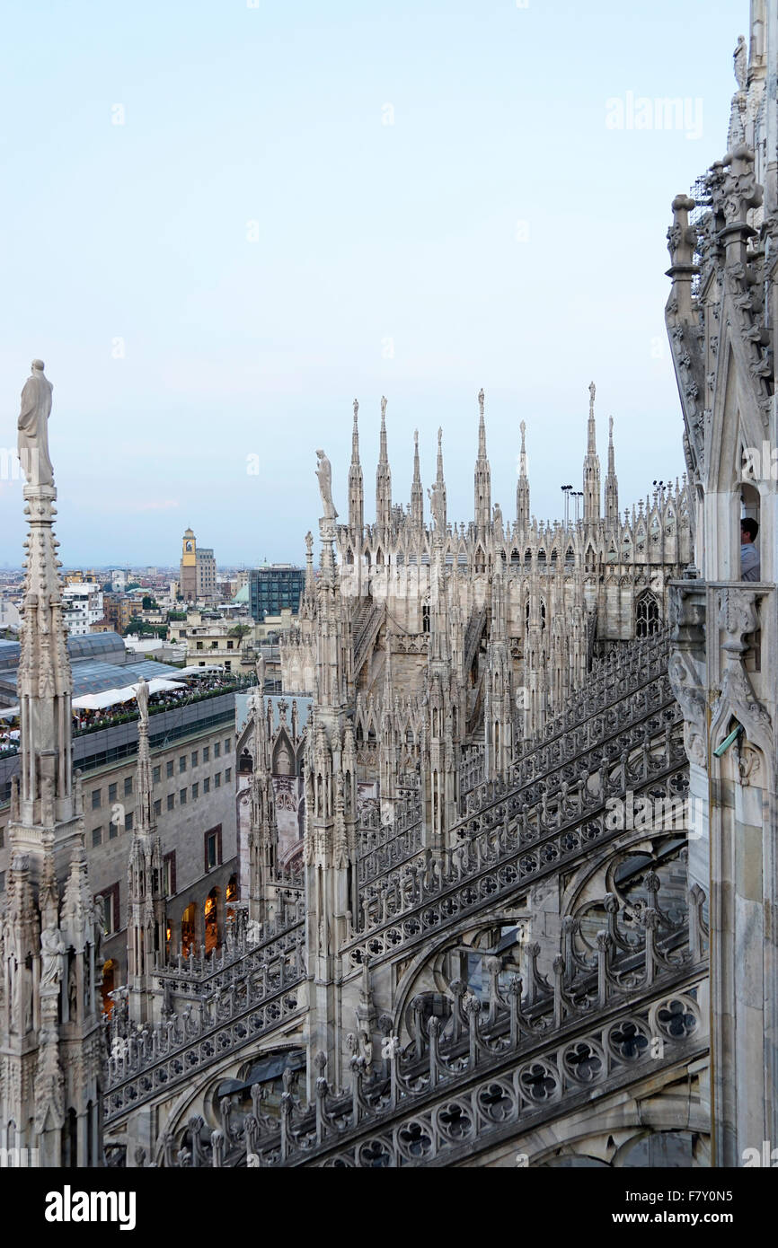 Spires on the rooftop of Milan Cathedral with the cityscape in the ...