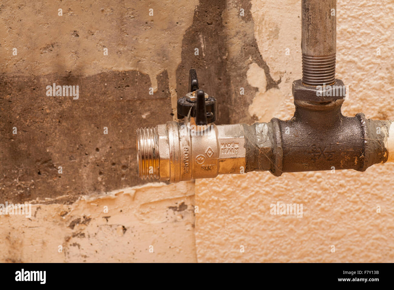 Plumbing pipe with valve for installation of a radiator Stock Photo - Alamy