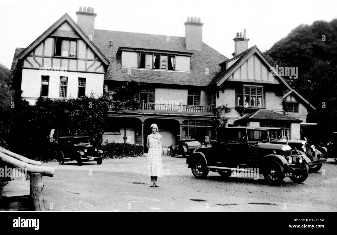 A lady named Winifred Paul poses outside The Hunters Inn on Exmoor in ...