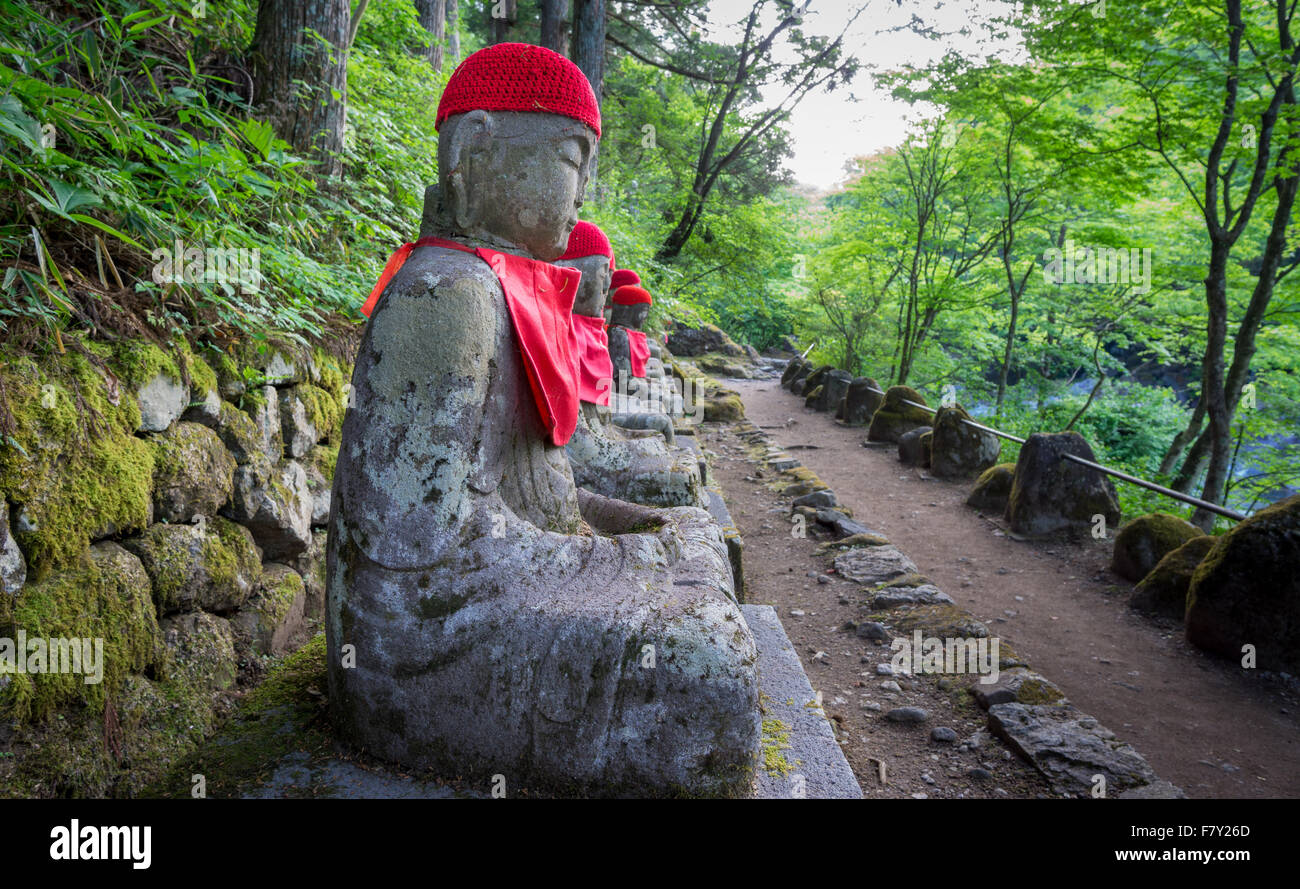 Wide angle of statues in Nikko with track Stock Photo - Alamy