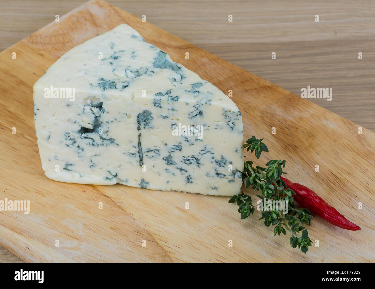 Blue cheese with mold on the wood background Stock Photo - Alamy