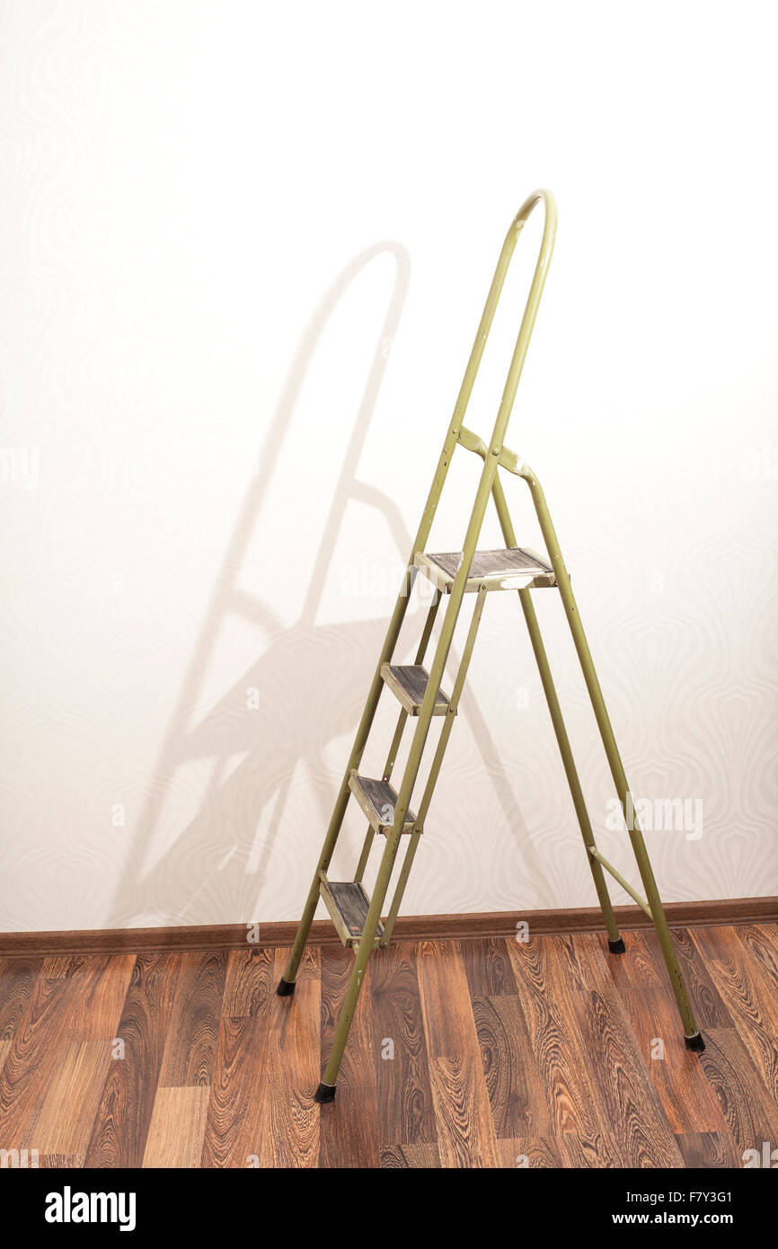 Metal Ladder in interior wooden floor Stock Photo - Alamy