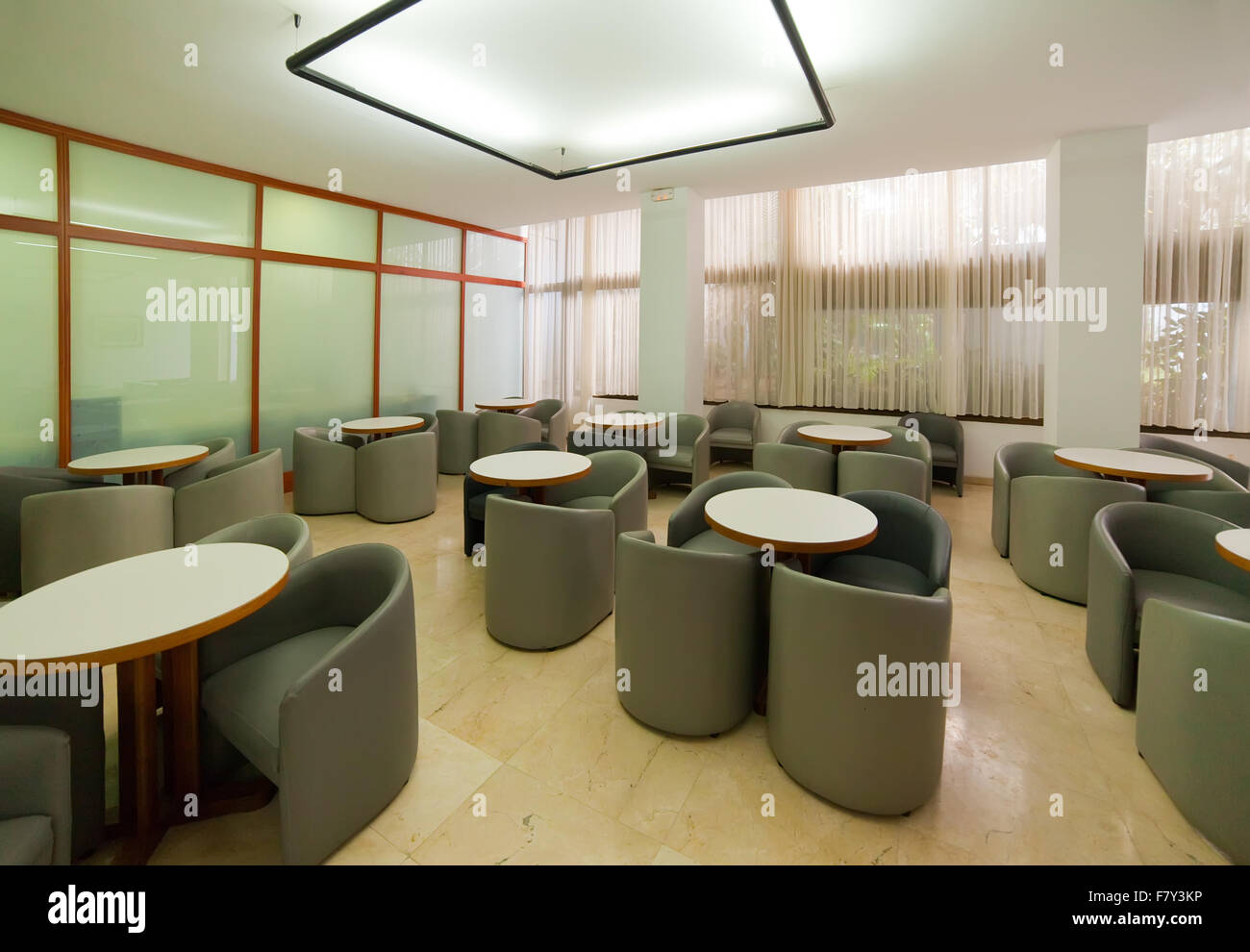 Interior of comfortable cafe with few table Stock Photo - Alamy