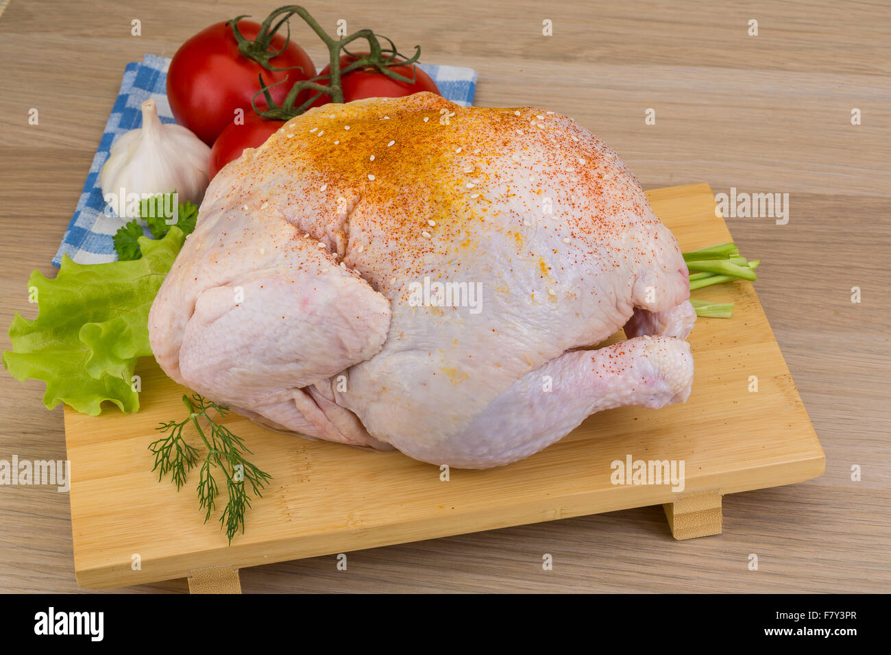 Raw chicken with herbs and spices ready for cooking Stock Photo - Alamy