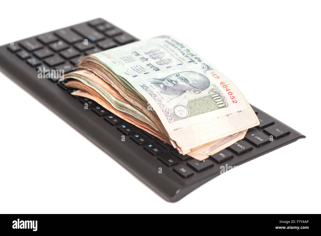 Money Indian Currency Rupee Notes on computer keyboard isolated on ...