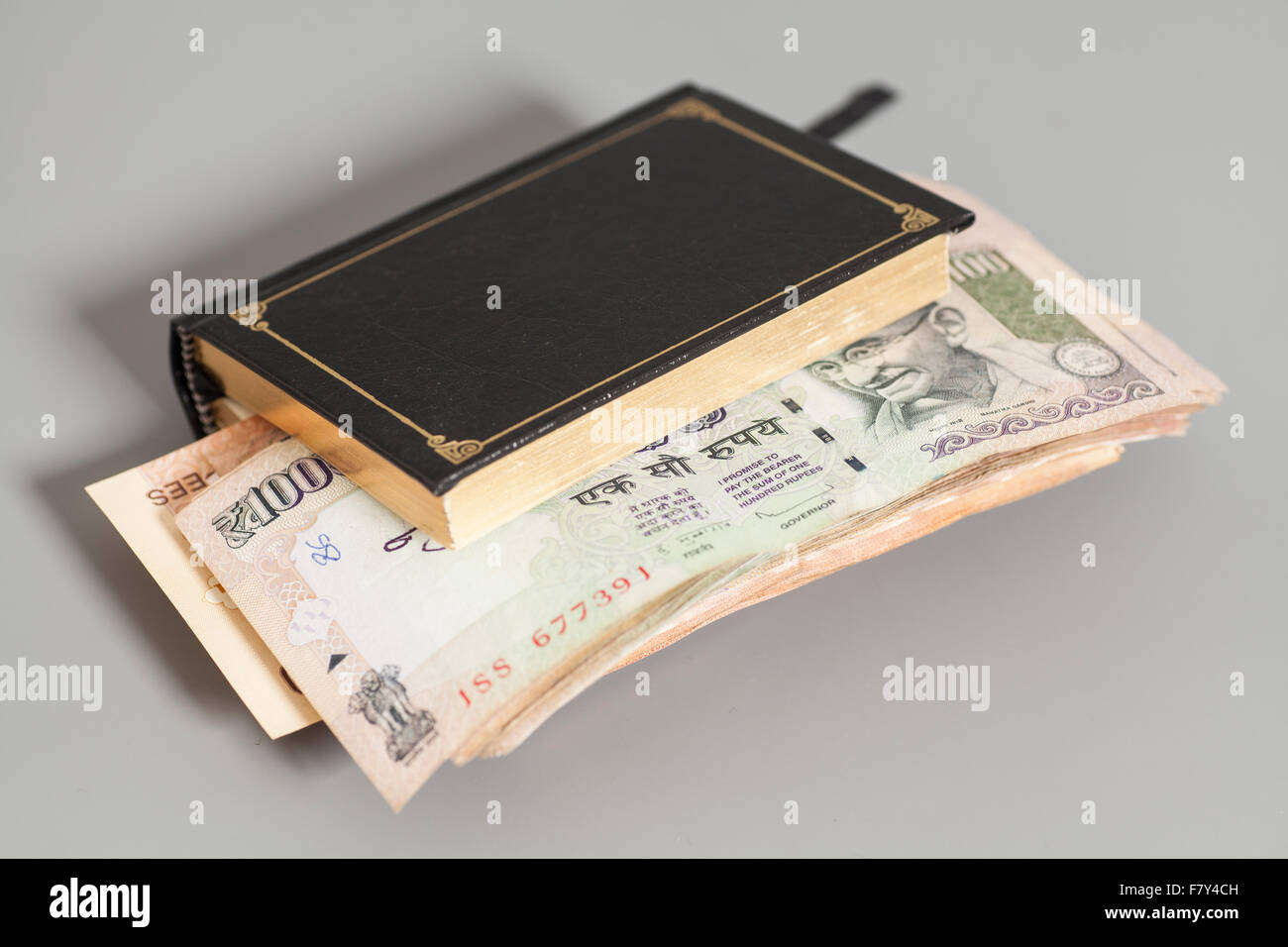 Book with Indian Currency Rupee bank notes on gray background Stock ...