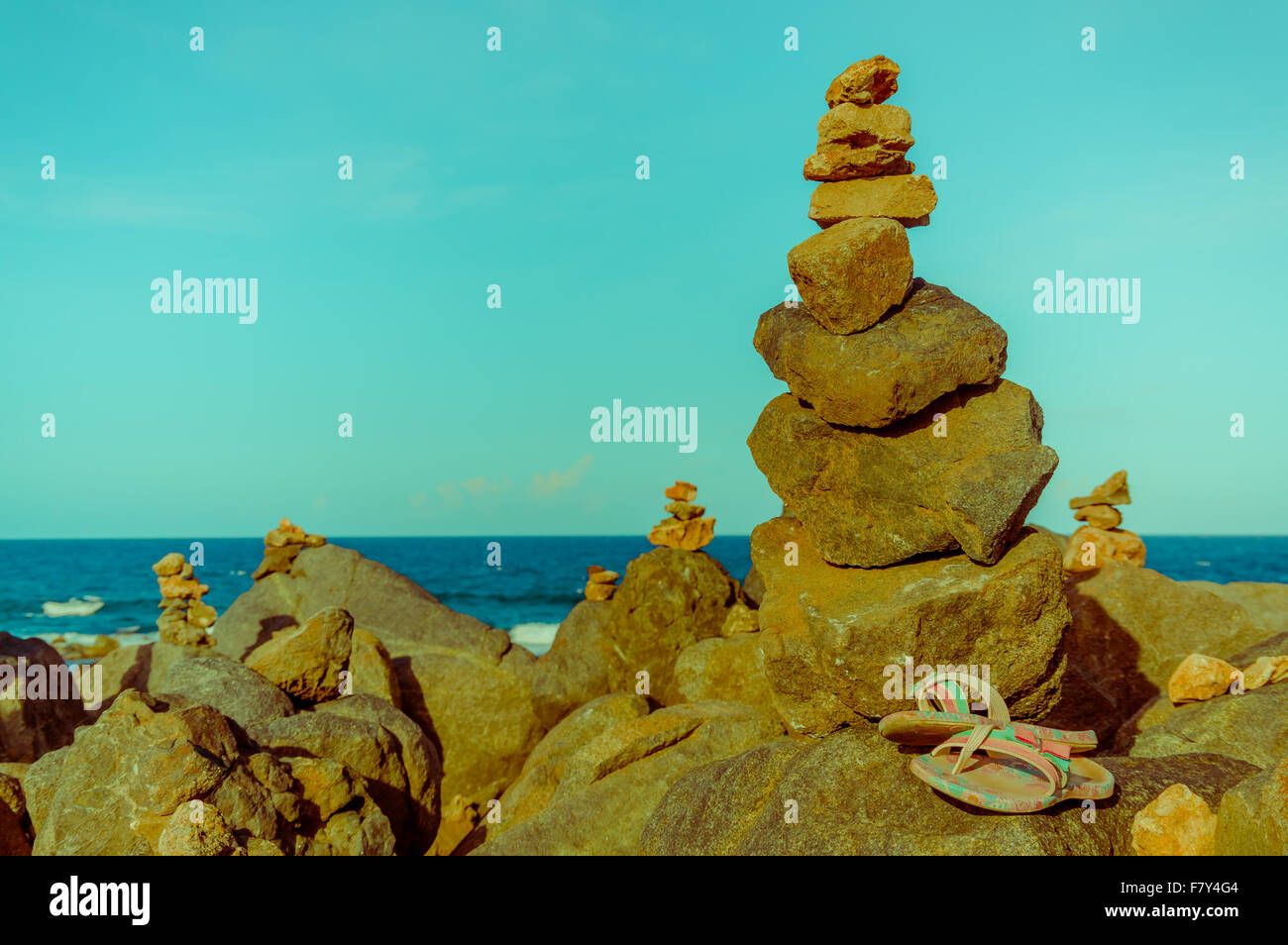 Stack of stones on sea shore, Aruba Stock Photo - Alamy