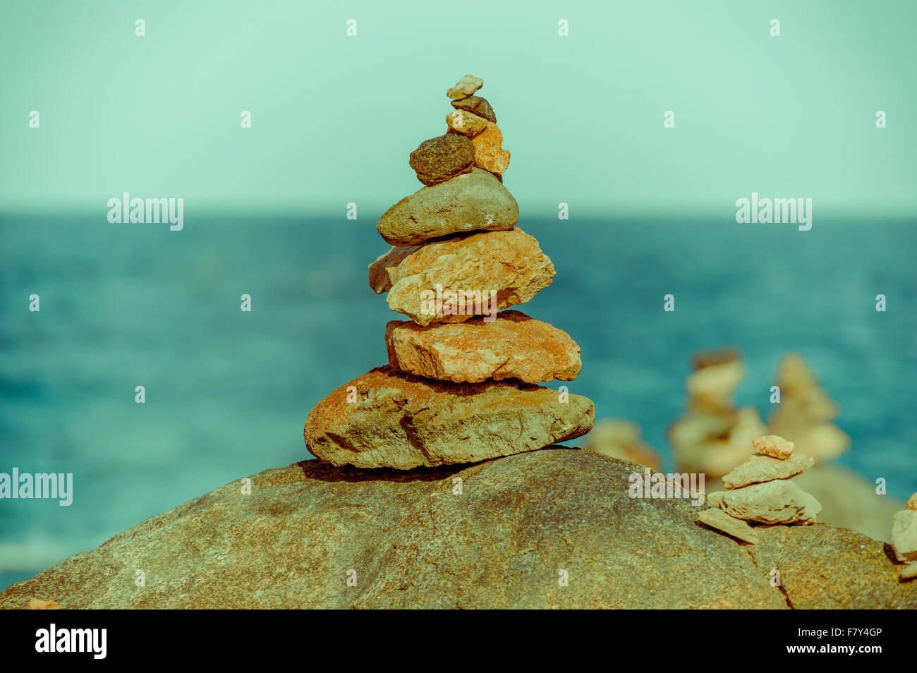 Stack of stones on sea shore, Aruba Stock Photo - Alamy