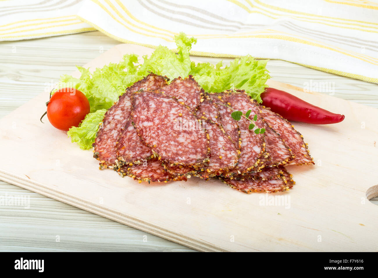 Sliced salami - with herbs and spices Stock Photo - Alamy