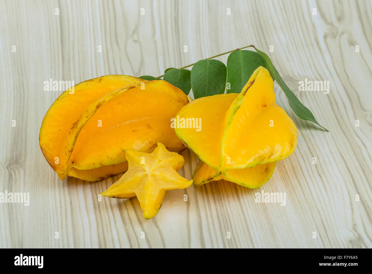 Asian fruit Carambola with leaves - for styling food Stock Photo - Alamy