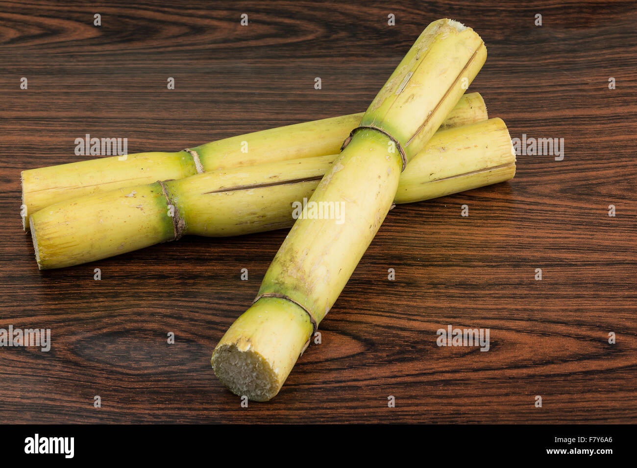 Sugar reed sticks on the wooden background Stock Photo - Alamy