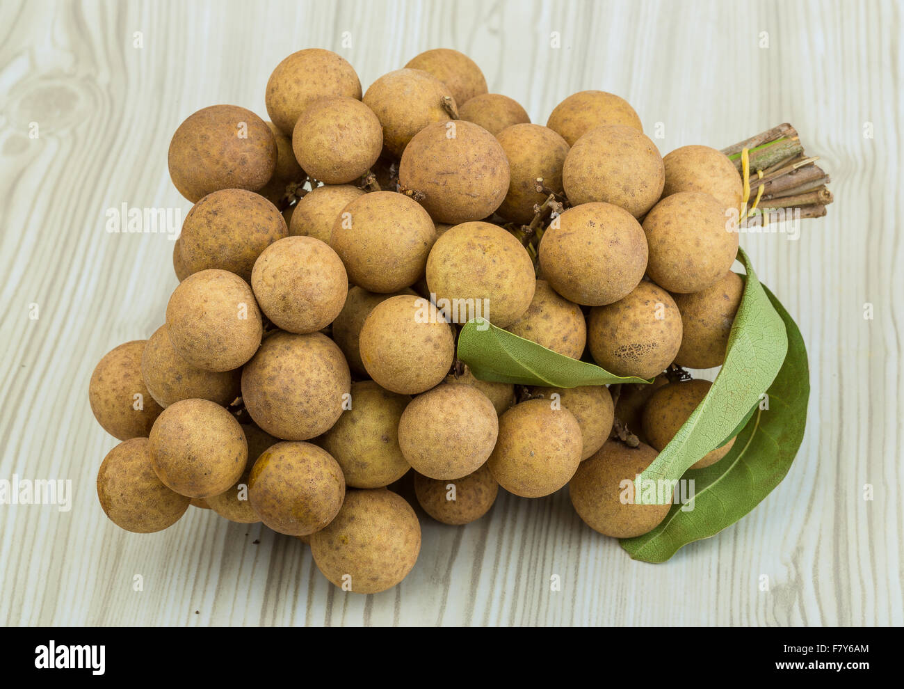 Asian fruit Longan - on wood background Stock Photo - Alamy