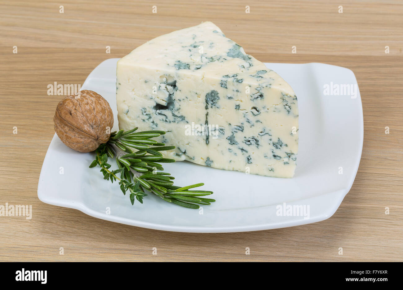 Blue cheese with mold on the wood background Stock Photo - Alamy