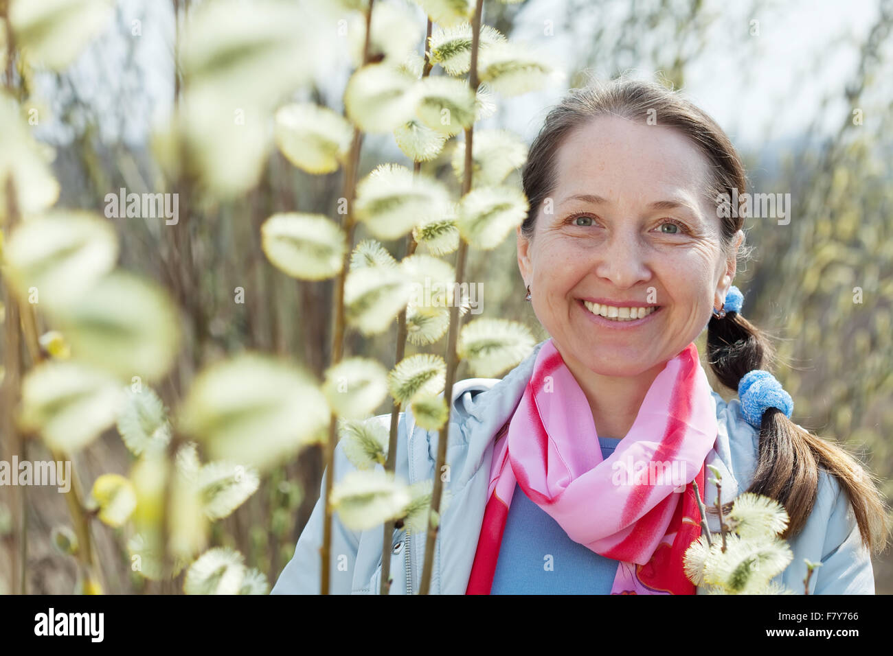 Smiling senior woman in spring willow twig with buds outdoor Stock ...